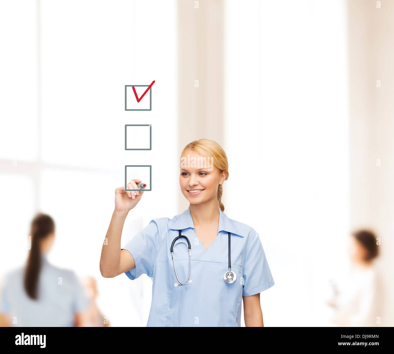 doctor or nurse drawing checkmark into checkbox Stock Photo - Alamy