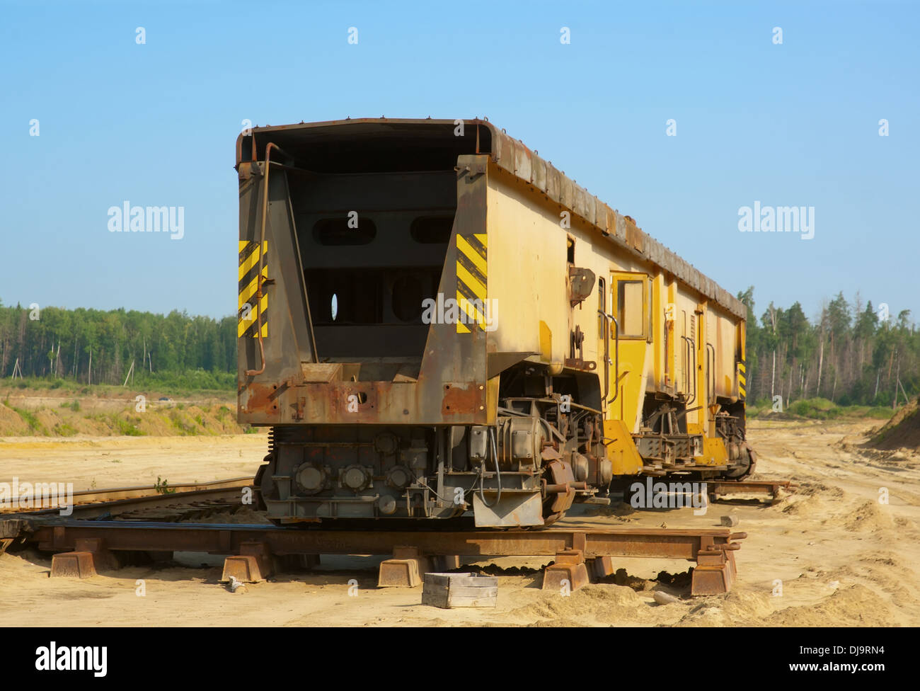 Train on mining career on rail Stock Photo - Alamy