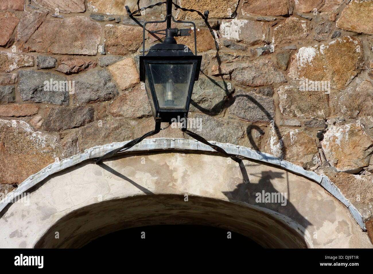 Close up of a Lantern over an old gate arch Stock Photo - Alamy