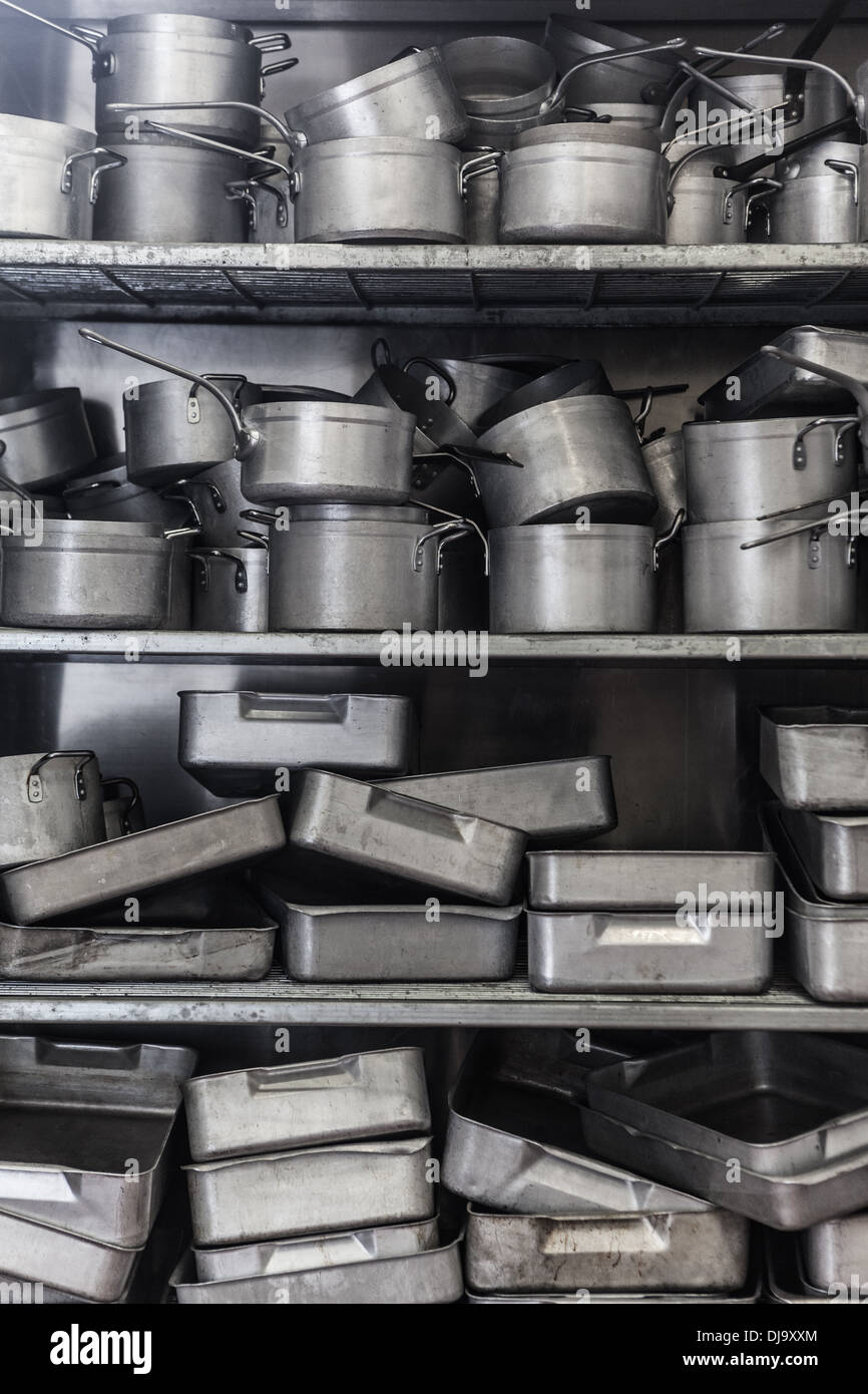 Shelf full of baking tins Stock Photo - Alamy