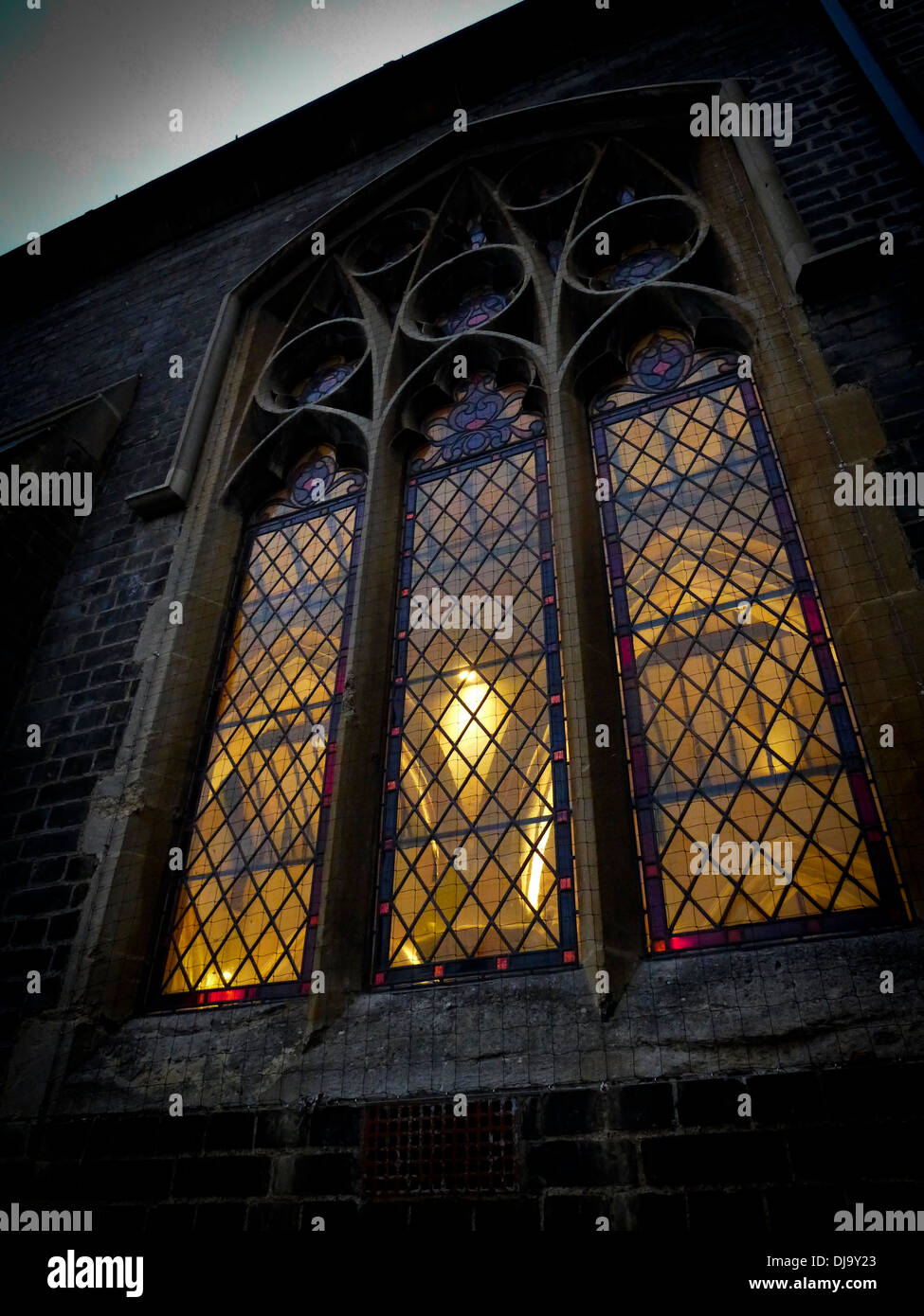 Looking through the leaded light window of the United Reformed Church ...