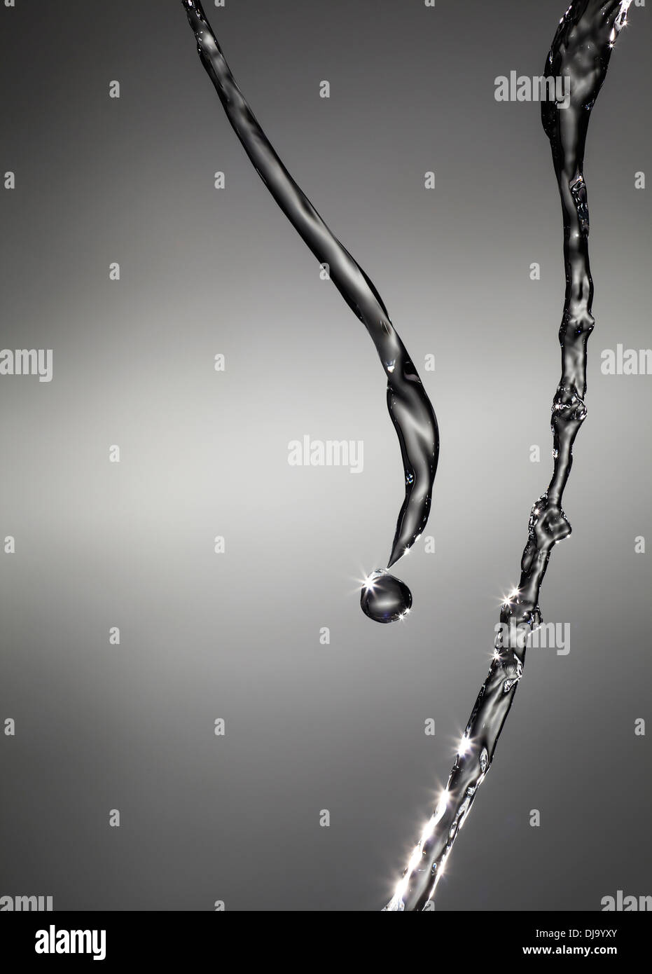 Falling water splashing with grey background Stock Photo - Alamy