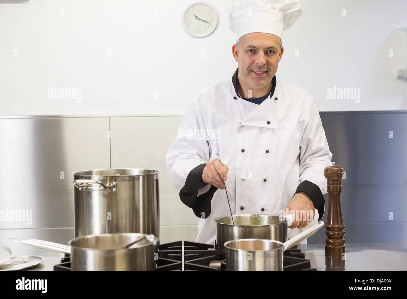 Chef holding ladle smiling hi-res stock photography and images - Alamy