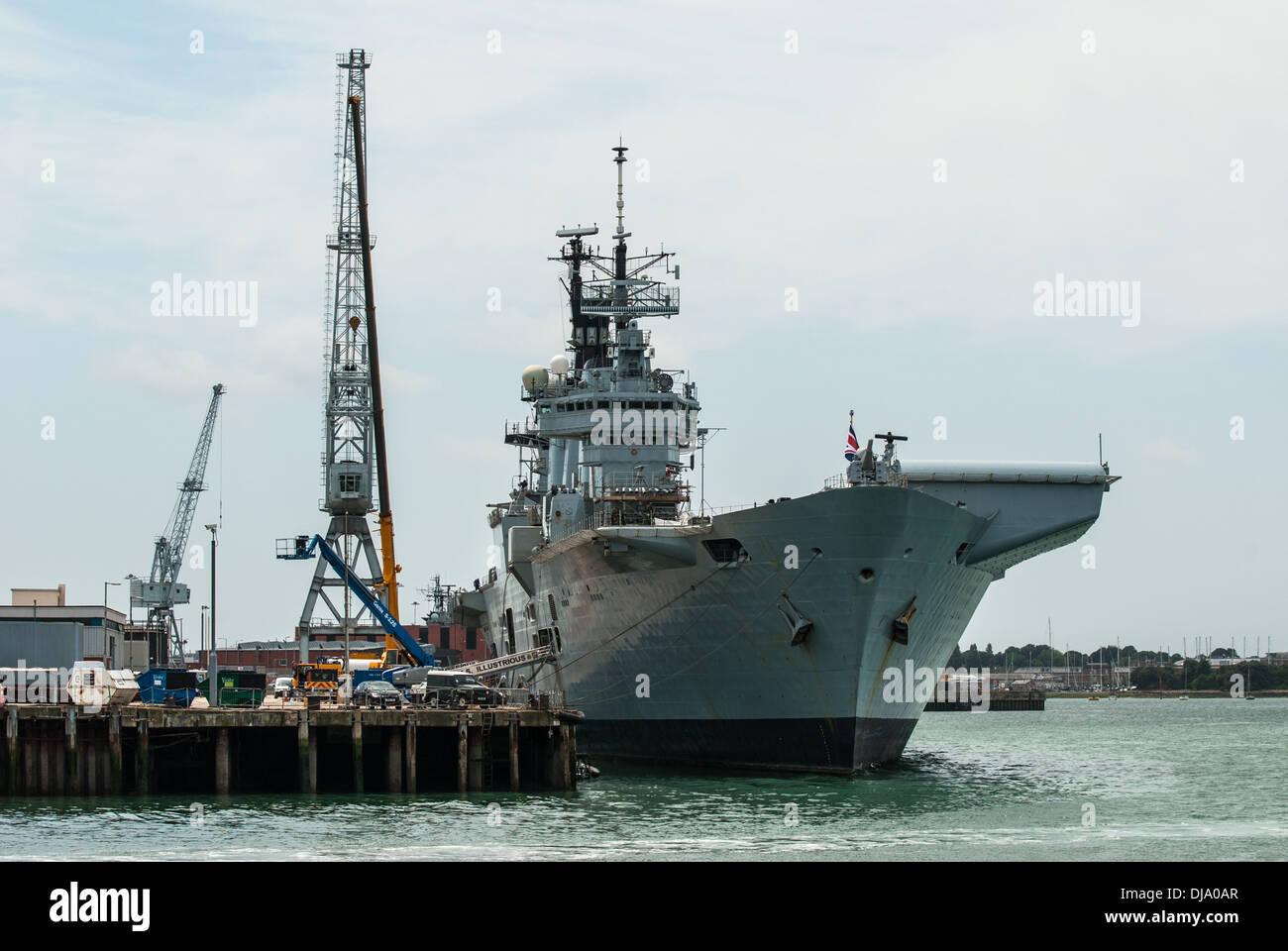 HMS Illustrious at the Royal Navy base at Portsmouth Harbour, England ...