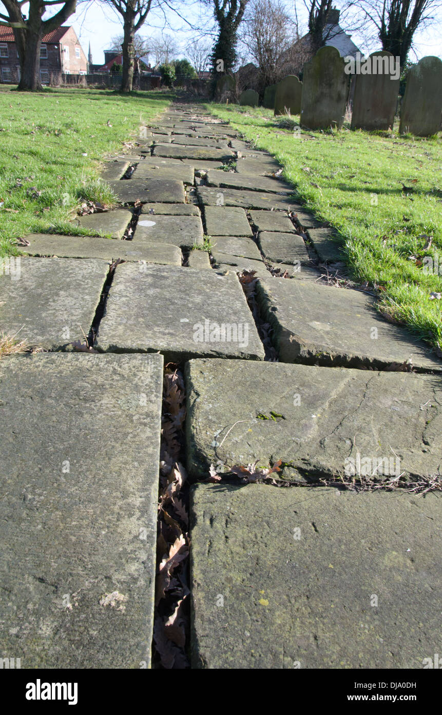 Lonely path across through grave yard Stock Photo - Alamy