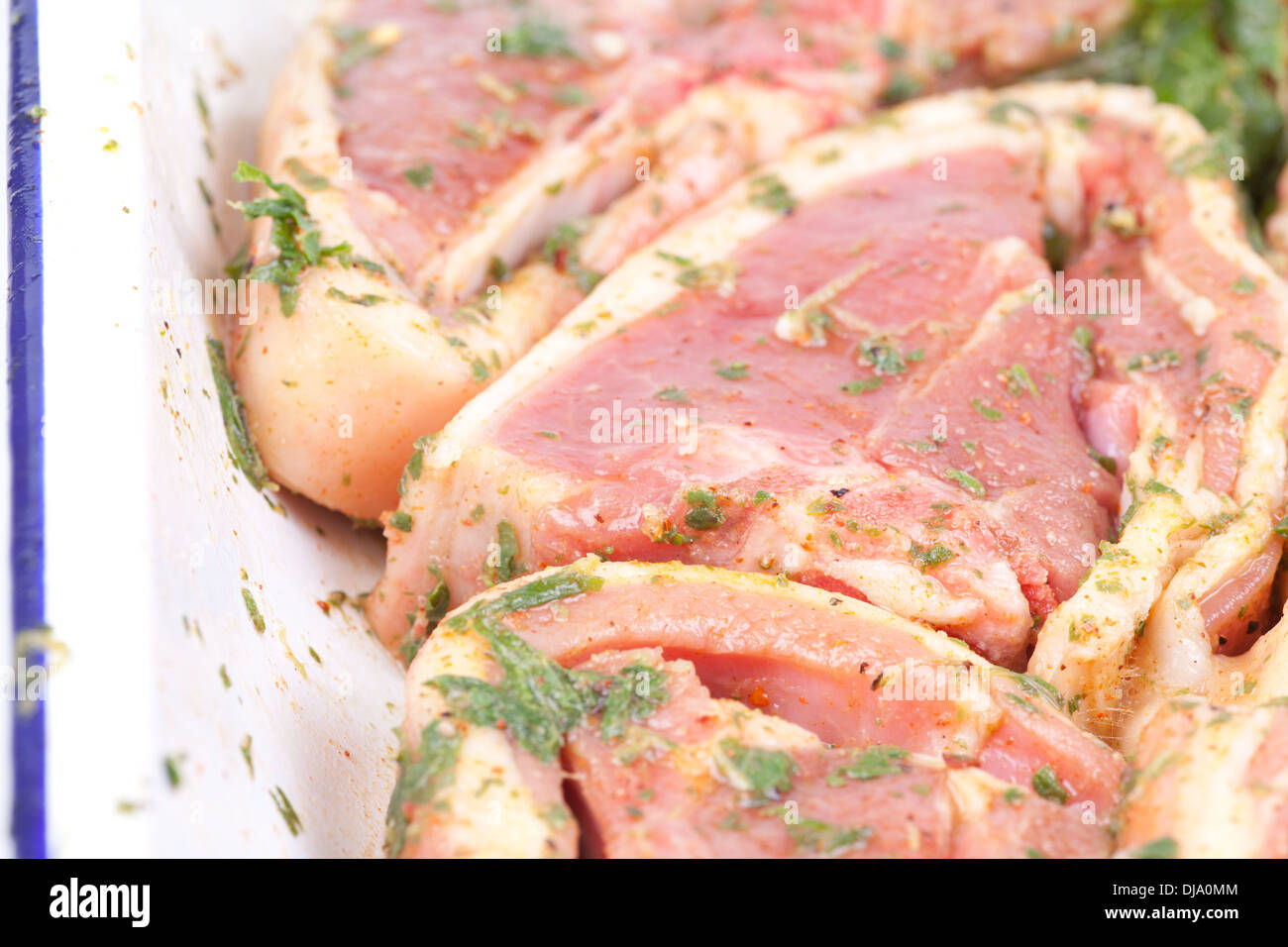 seasoned lamb chops prepared for cooking in the tray Stock Photo - Alamy