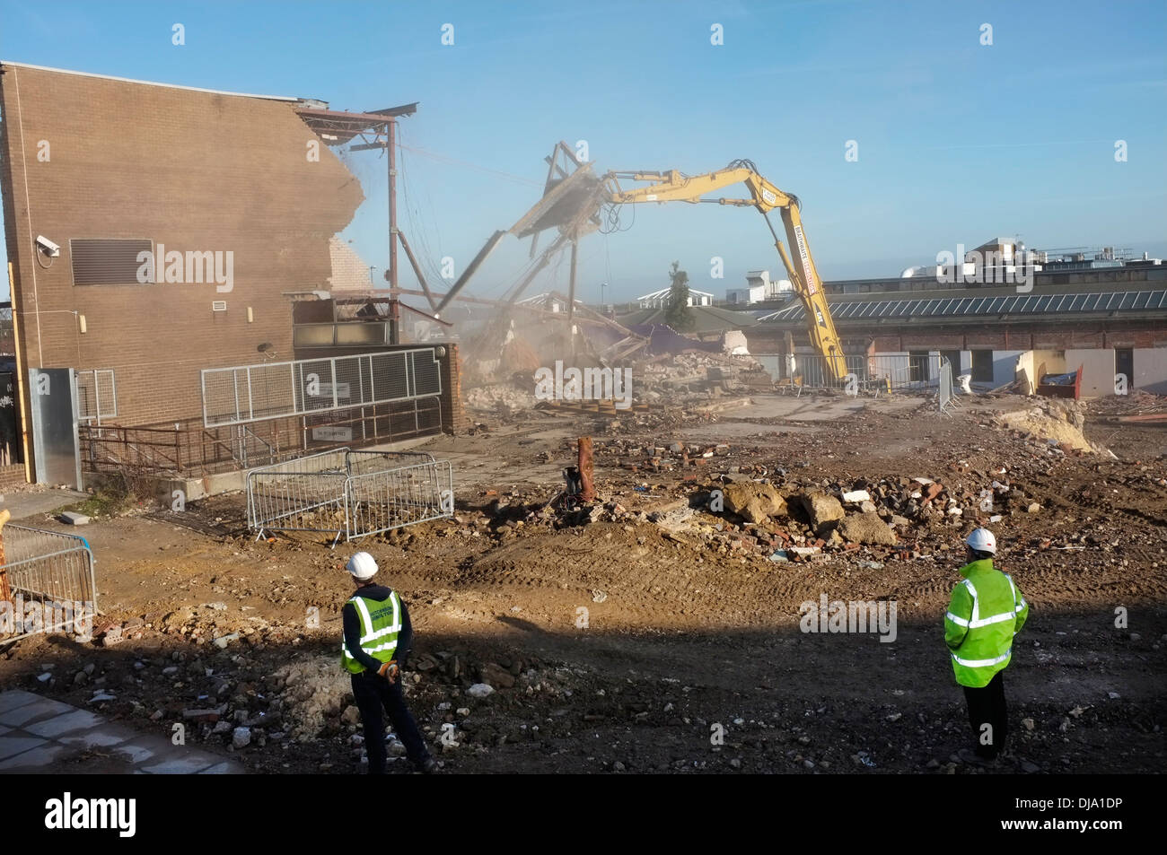 JCB Demolishing an old brick building Stock Photo - Alamy