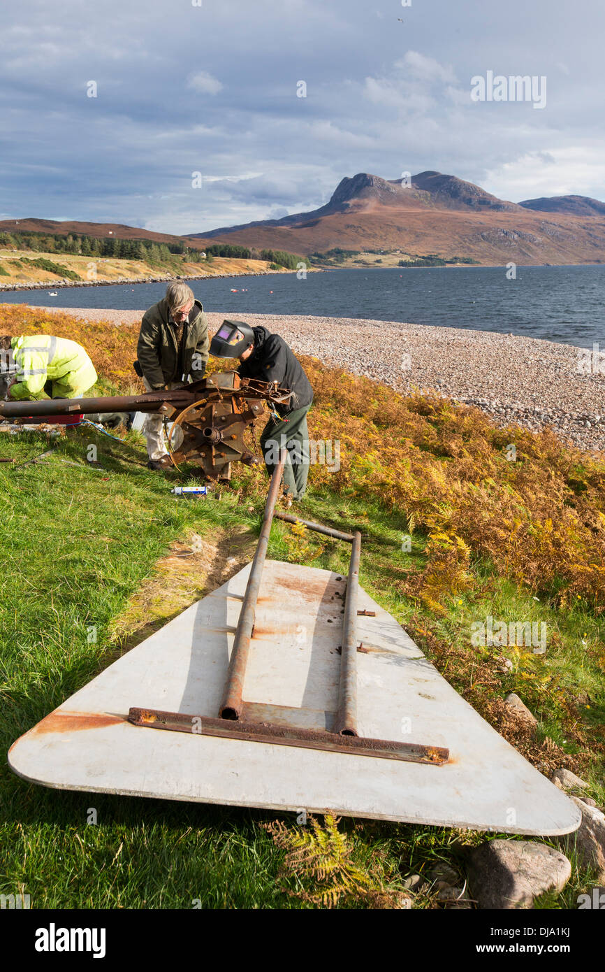 Hugh Piggott doing maintenance on his home made wind turbines in ...