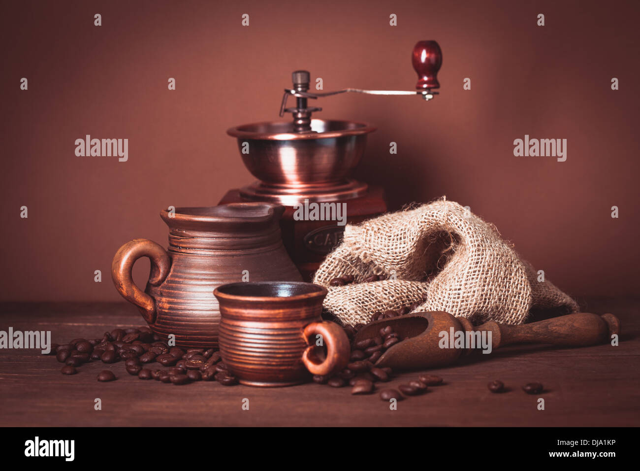 Coffee still life in rustic style over brown background Stock Photo - Alamy