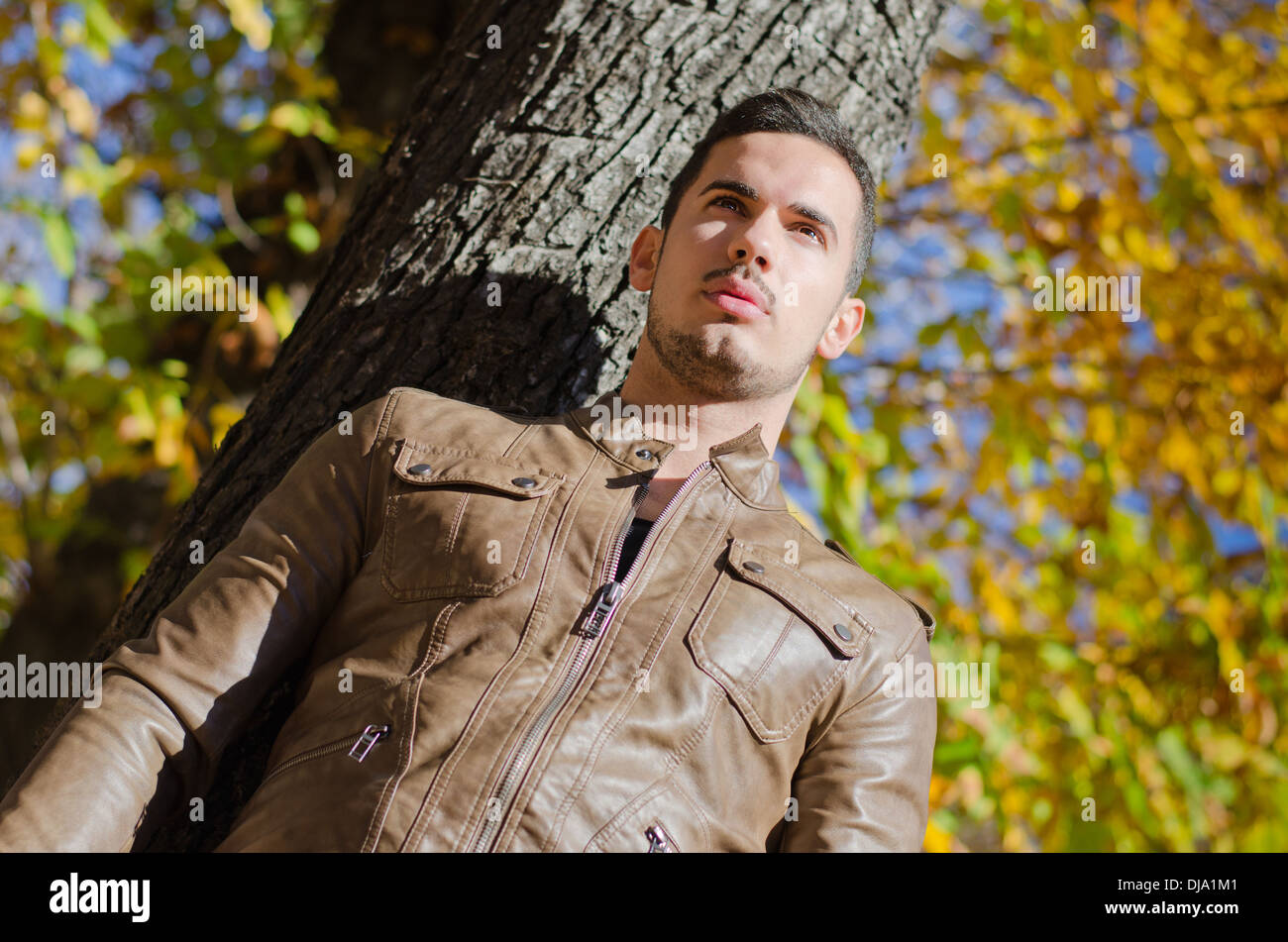 Man pose against tree hi-res stock photography and images - Alamy