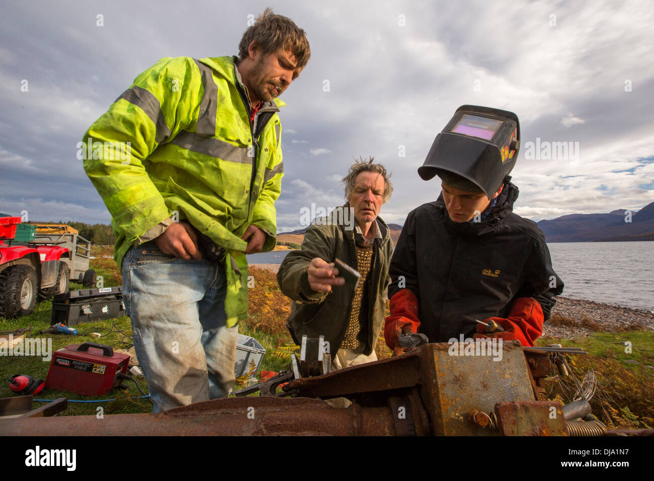 Hugh Piggott doing maintenance on his home made wind turbines in ...