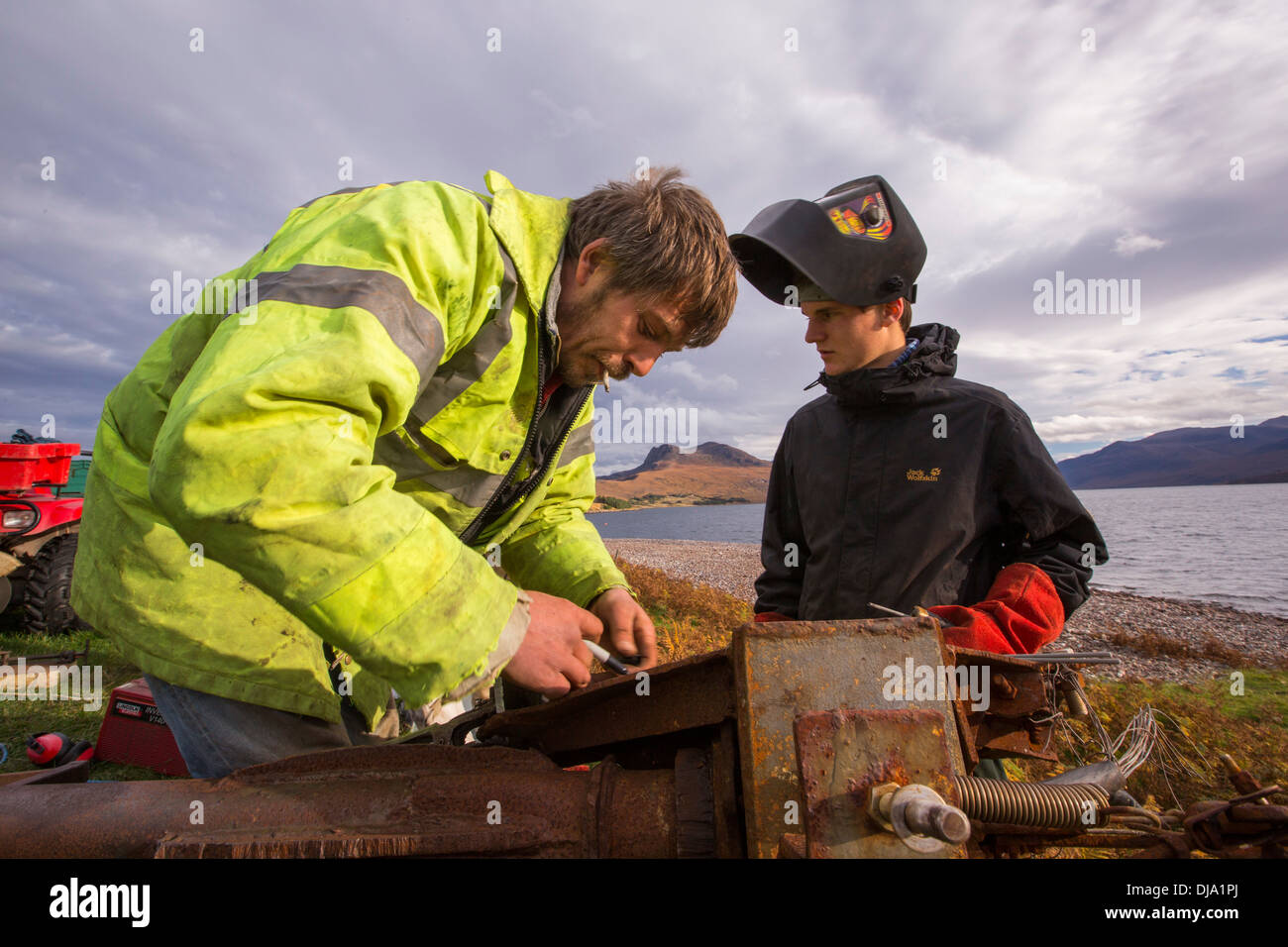 Hugh Piggott doing maintenance on his home made wind turbines in ...