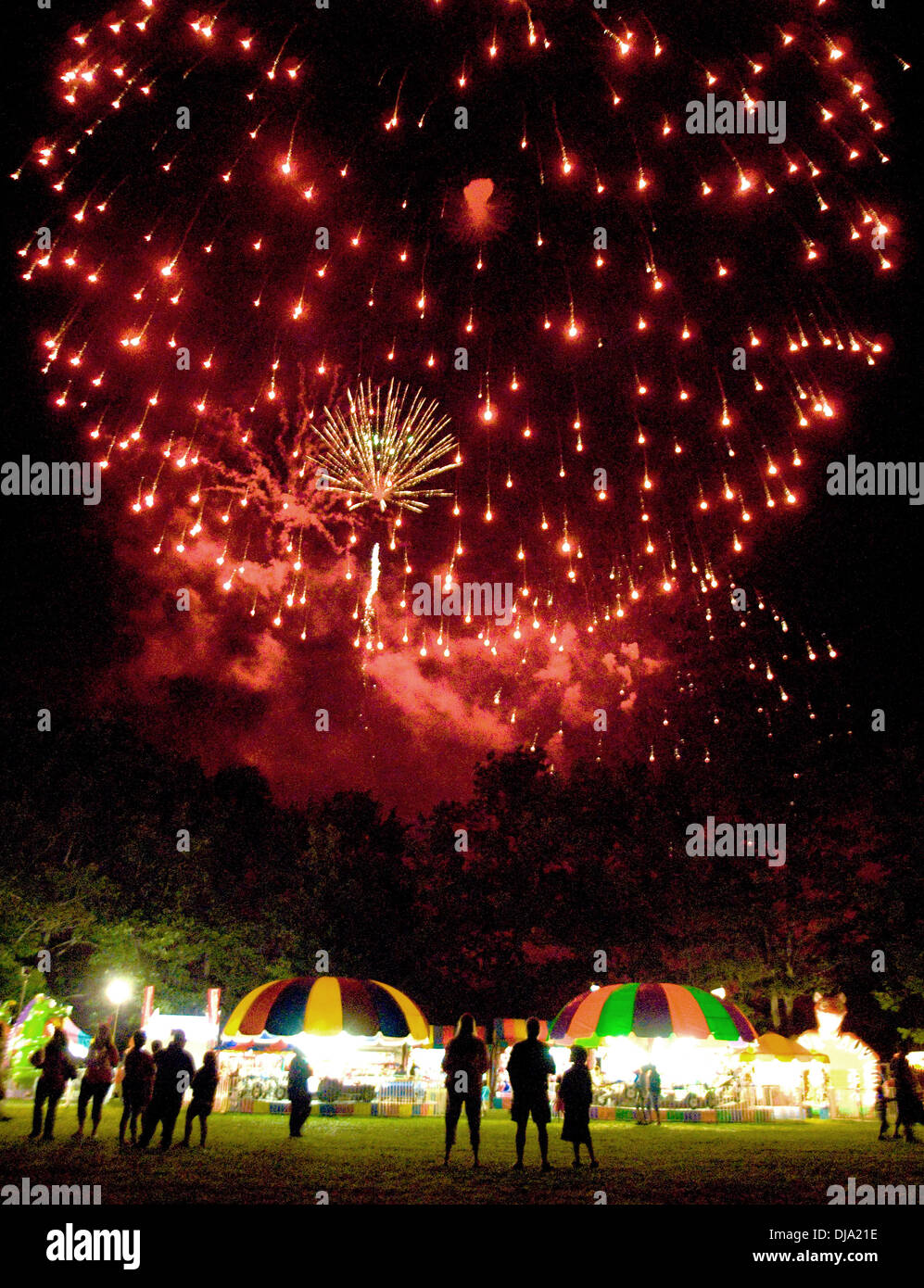 Red fireworks form a heart over a summer fair Stock Photo - Alamy