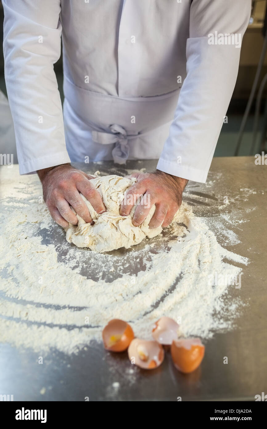Close up professional baker kneading hi-res stock photography and ...