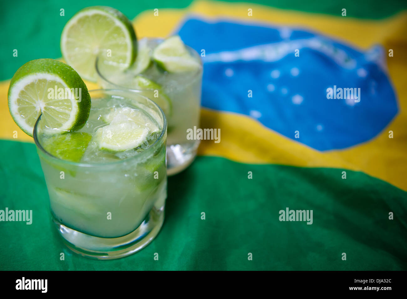 Two authentic fresh lime caipirinhas on Brazilian flag Stock Photo - Alamy