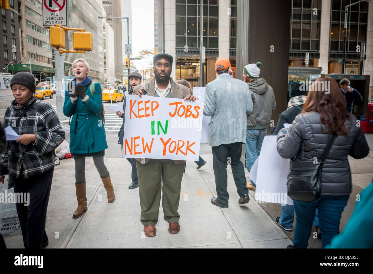 Bank or America workers and their supporters protest the replacement of ...