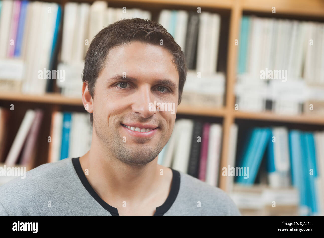 Attractive man posing in library hi-res stock photography and images ...