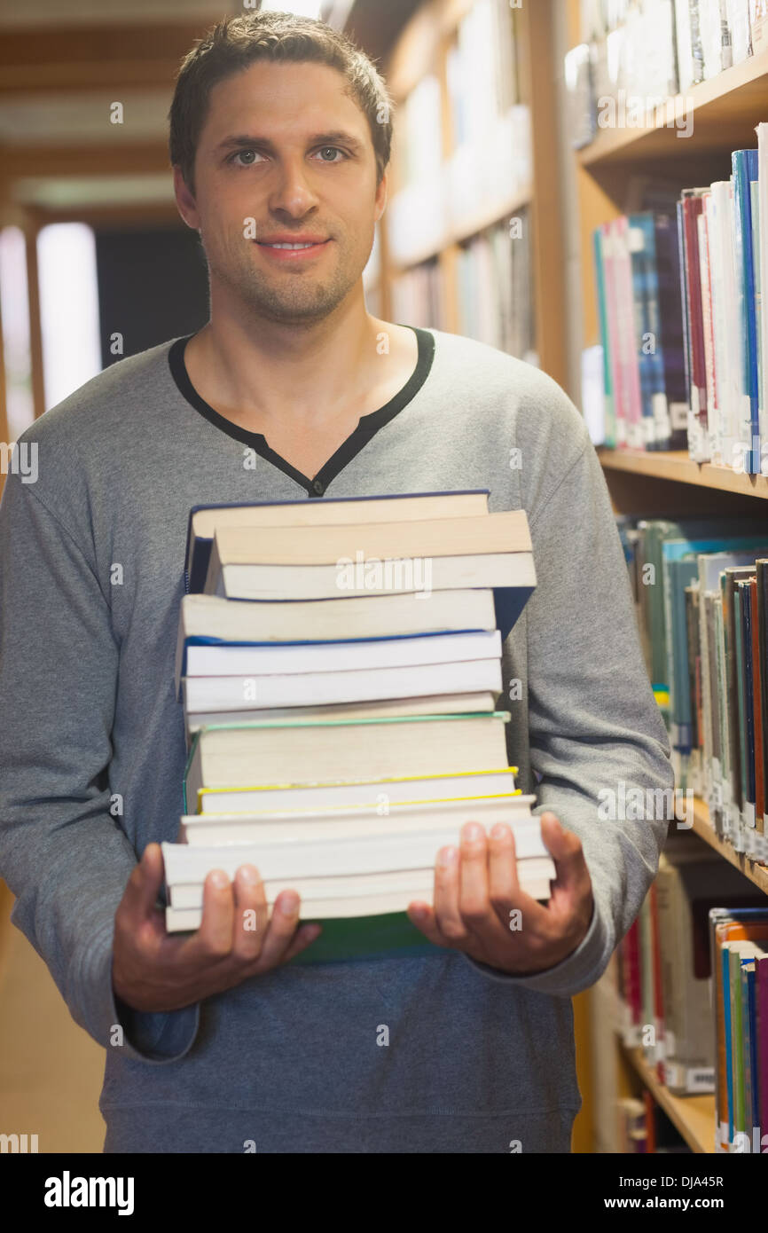 Attractive man posing in library hi-res stock photography and images ...