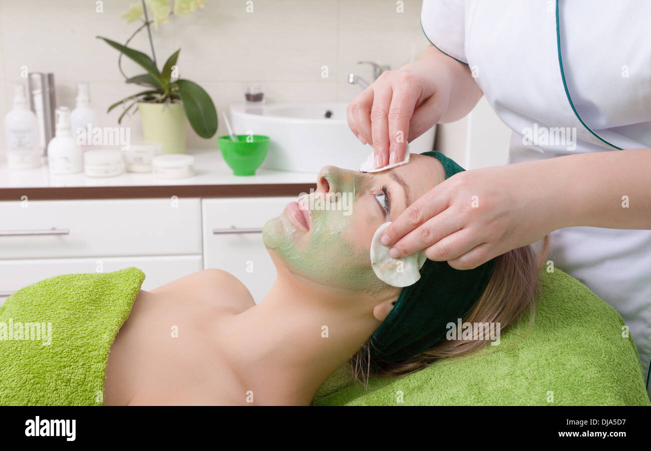 In spa beauty salon. Woman with green facial mask. Relax Stock Photo ...