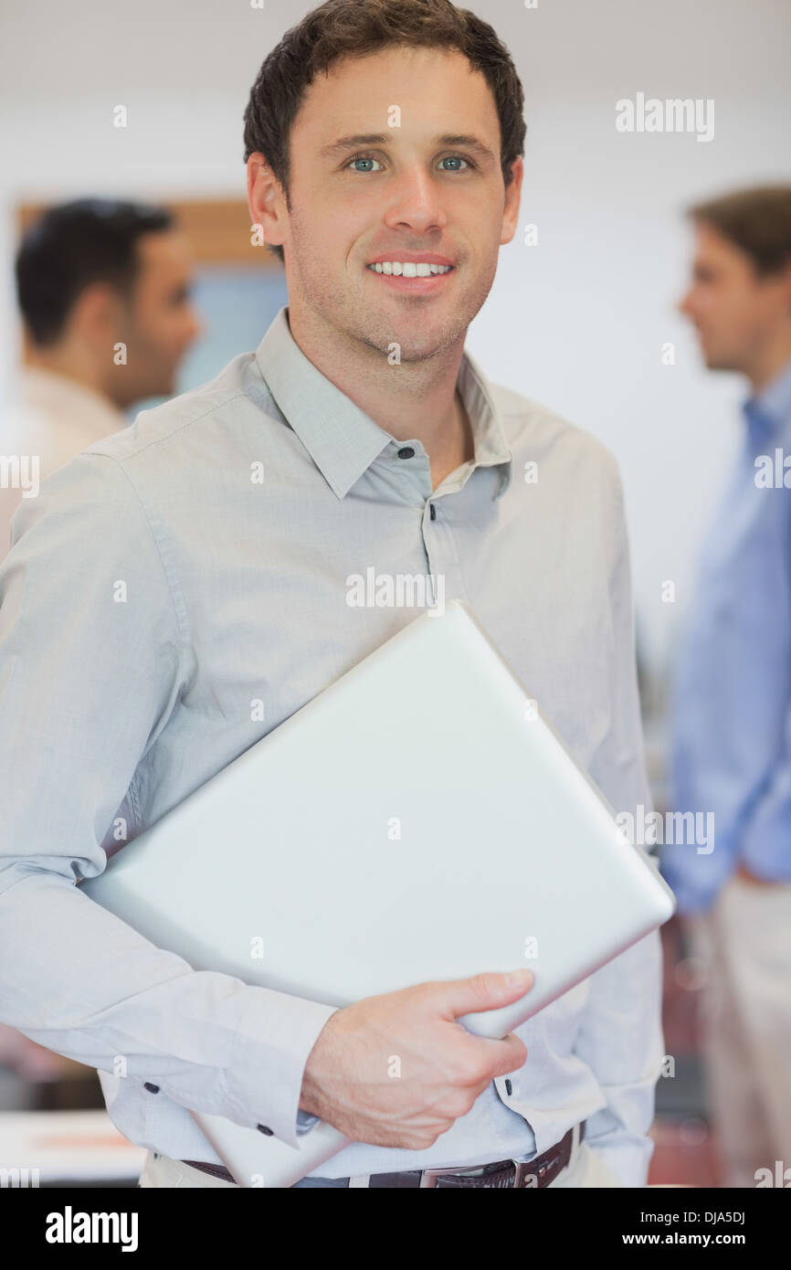 Attractive male mature student posing in classroom Stock Photo - Alamy