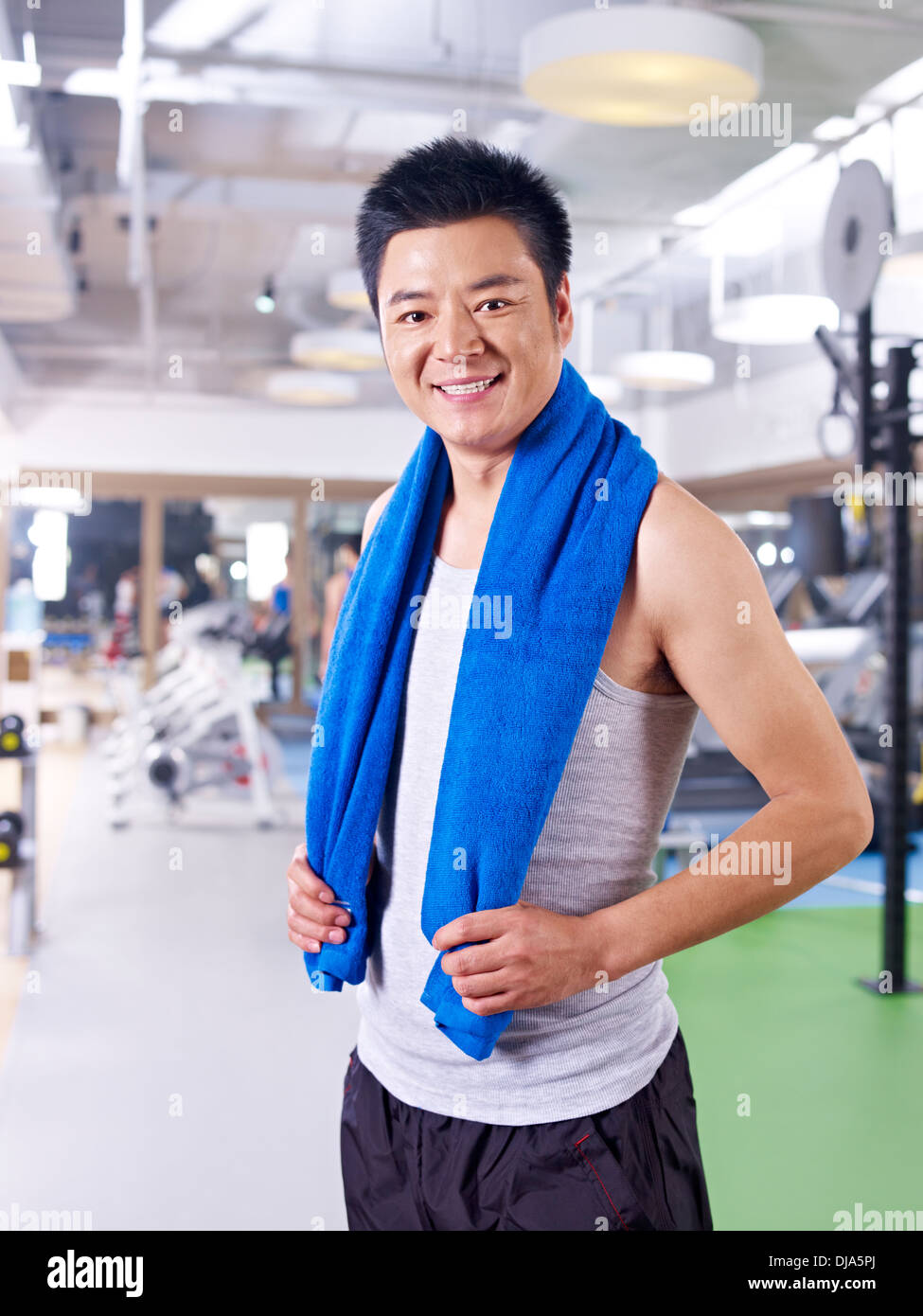 man standing in gym smiling Stock Photo - Alamy