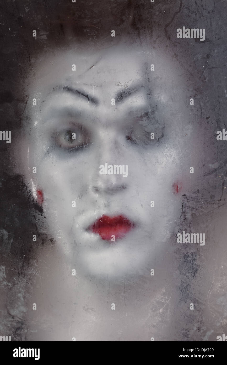 Scary face screaming mime for murky glass closeup Stock Photo - Alamy