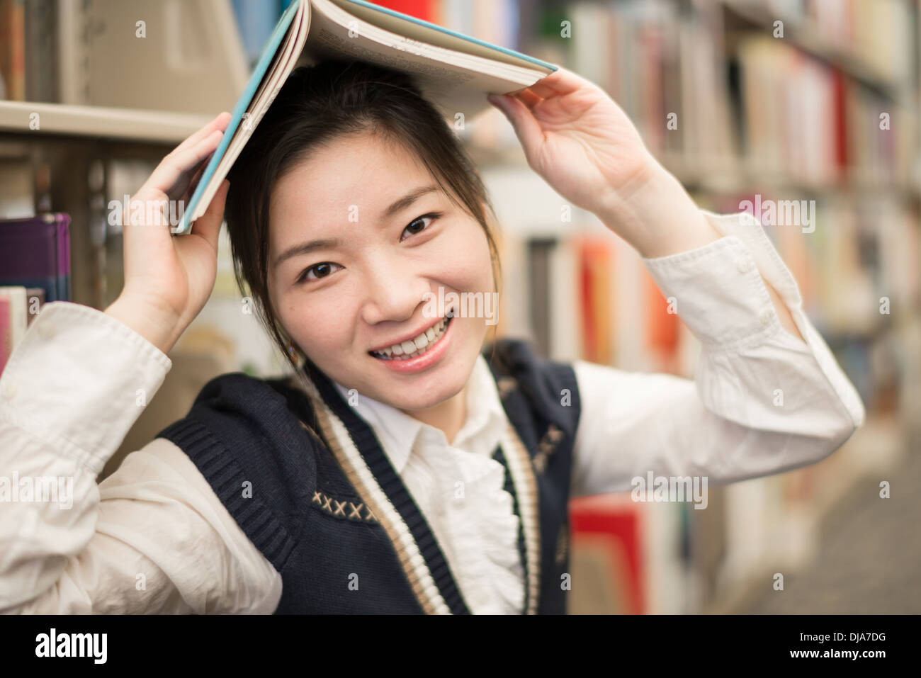 Book over the head hi-res stock photography and images - Alamy