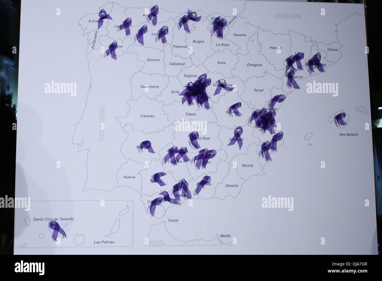 Madrid, Spain. 25th Nov, 2013. A map of spain with purple ties on it ...