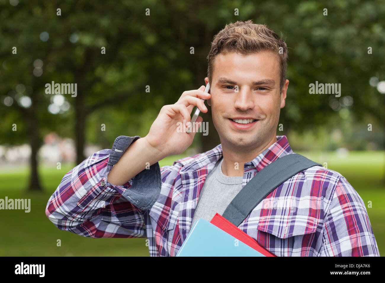 Handsome cheerful student standing hi-res stock photography and images ...