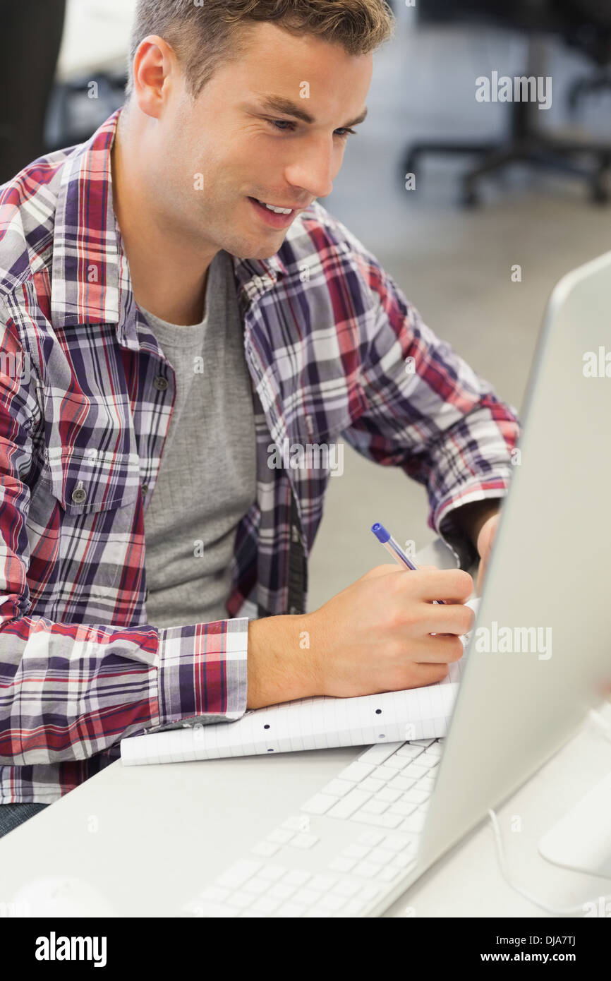 Sitting writing computer monitor technology learning education hi-res ...