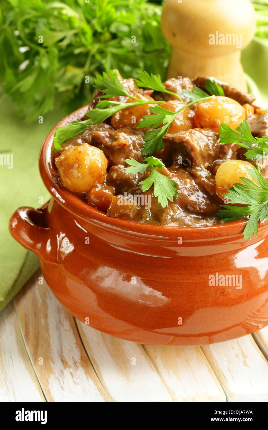 Beef stew with vegetables and herbs in a clay pot - comfort food Stock ...