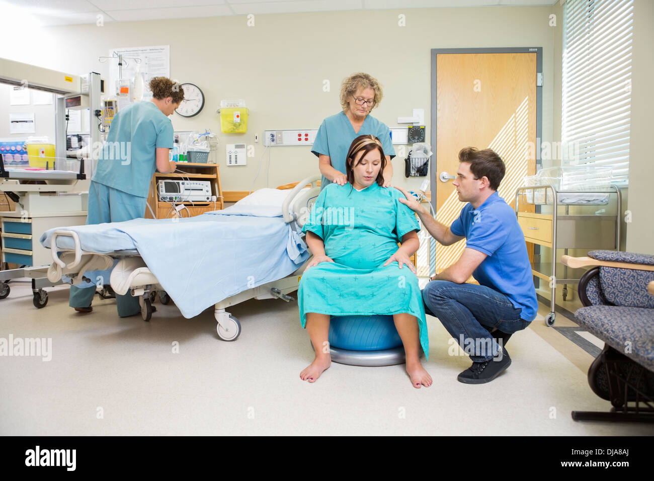 Birthing Mother in Hospital having Contraction Stock Photo - Alamy