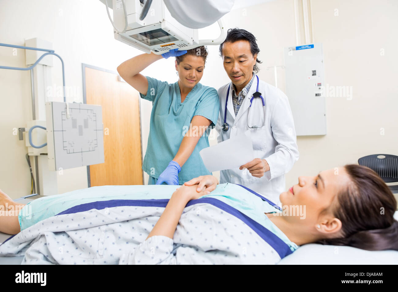 Medical Team Preparing Patient In Xray Room Stock Photo - Alamy