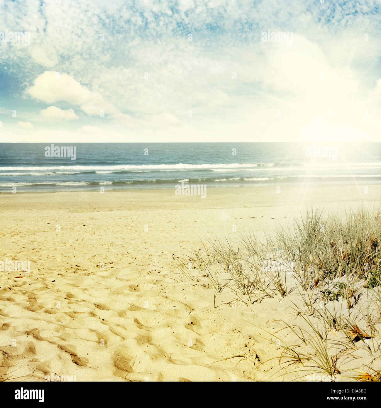 Sand, water and sky beach scenery Stock Photo - Alamy