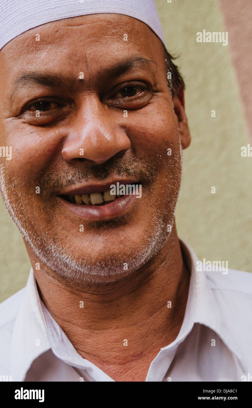 Arab man sharing a smile in the streets of Deira. Dubai, United Arab ...
