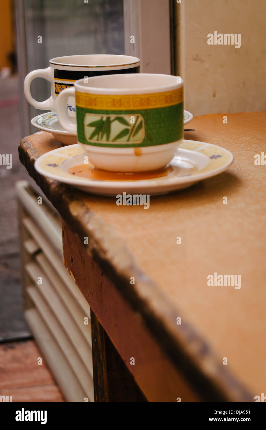 Two empty cups of coffee on a table outside a restaurant in Deira ...
