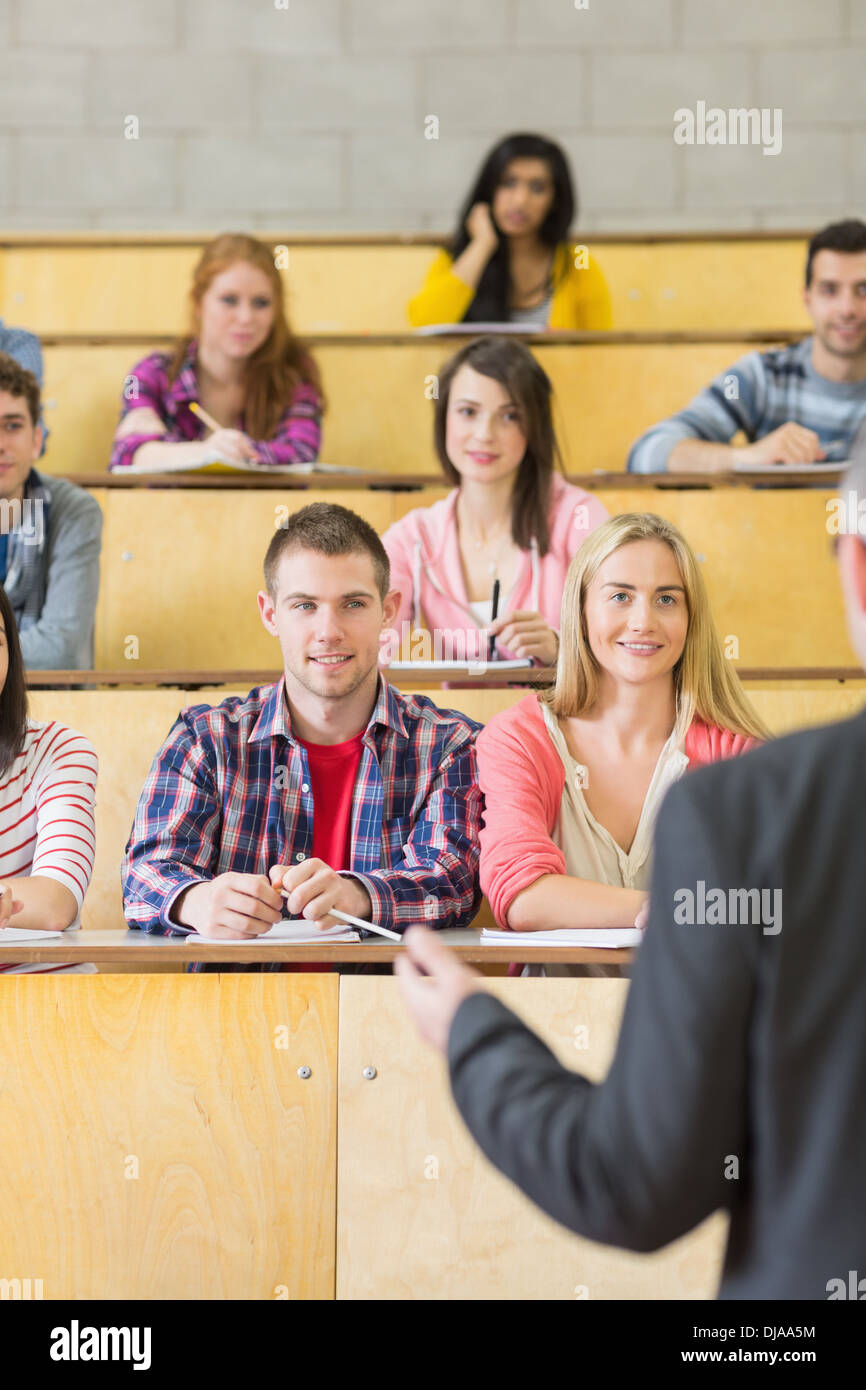 Elegant teacher with students at the lecture hall Stock Photo - Alamy