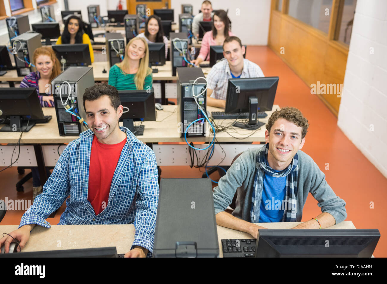 Smiling students in the college computer room Stock Photo - Alamy