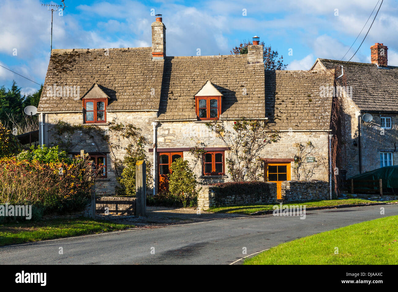 A pretty stone cottage in the Gloucestershire village of Dunfield Stock ...