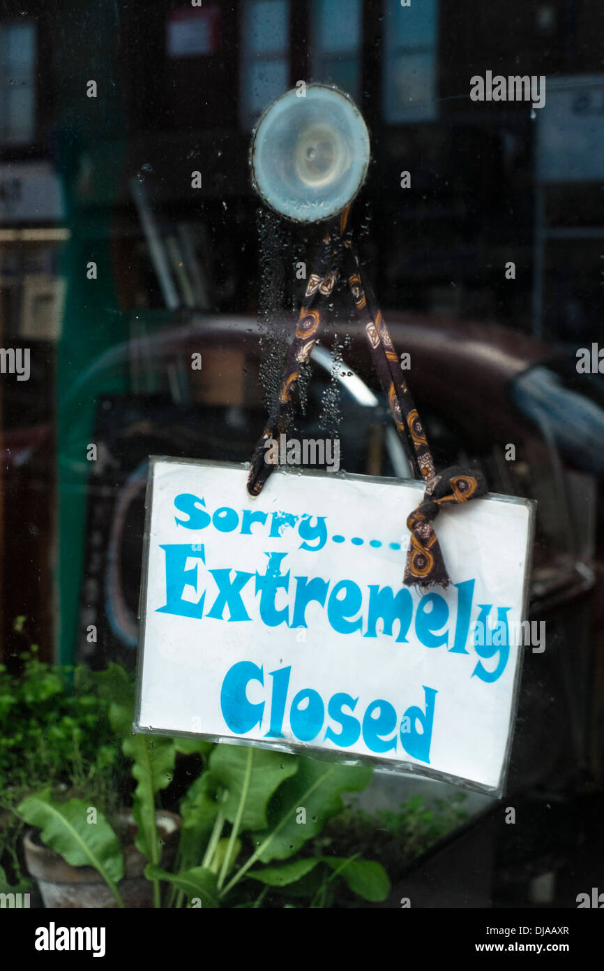 Sign in a shop window saying “Sorry Extremely Closed” Stock Photo - Alamy