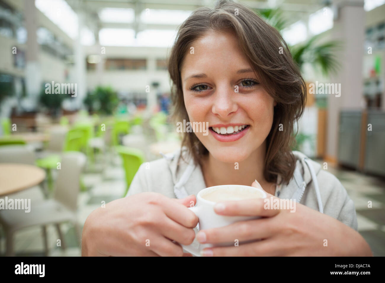 Smiling student drinking tea hi-res stock photography and images - Alamy
