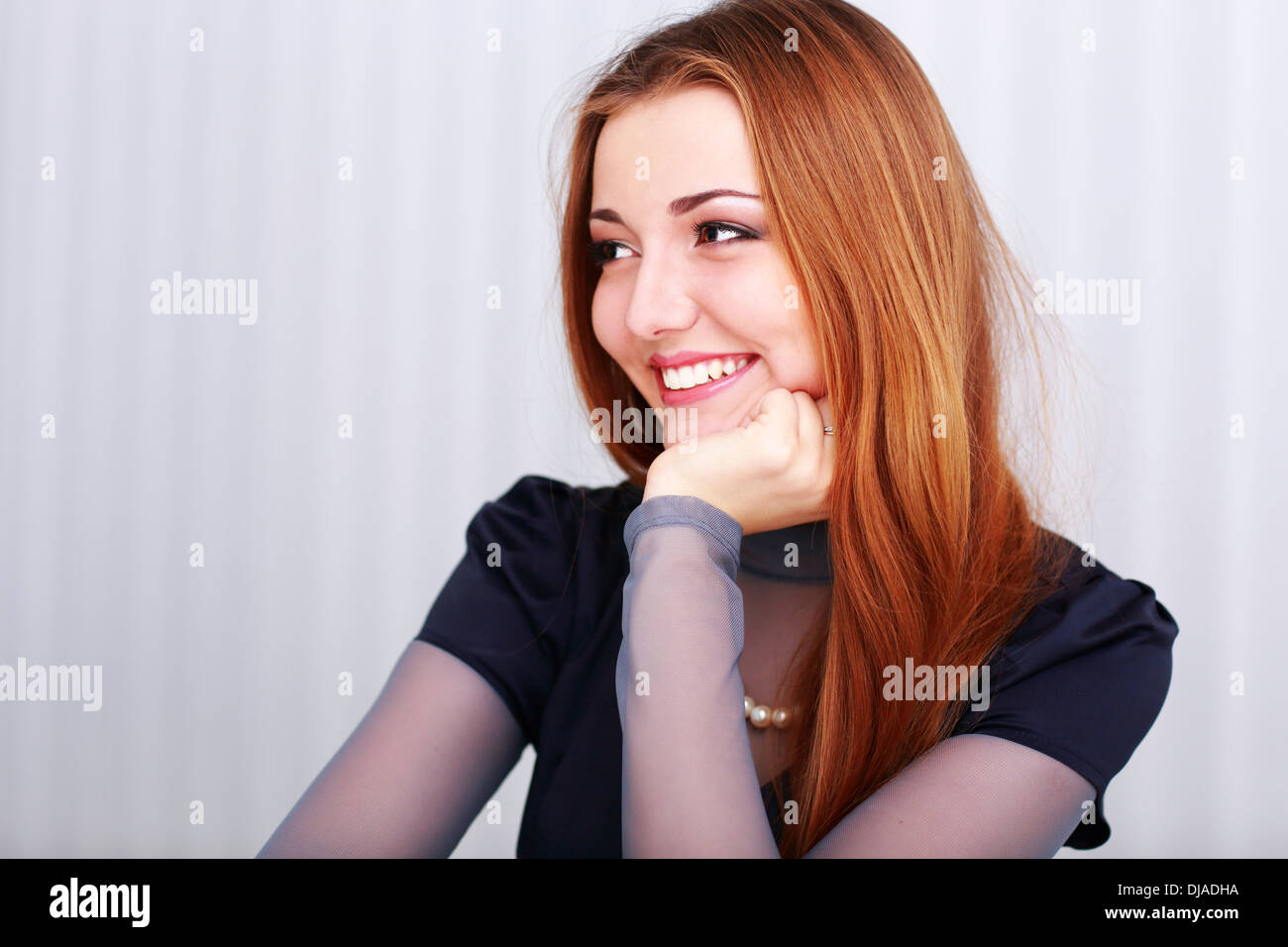 Portrait of a young beautigul happy woman looking right at copyspace ...