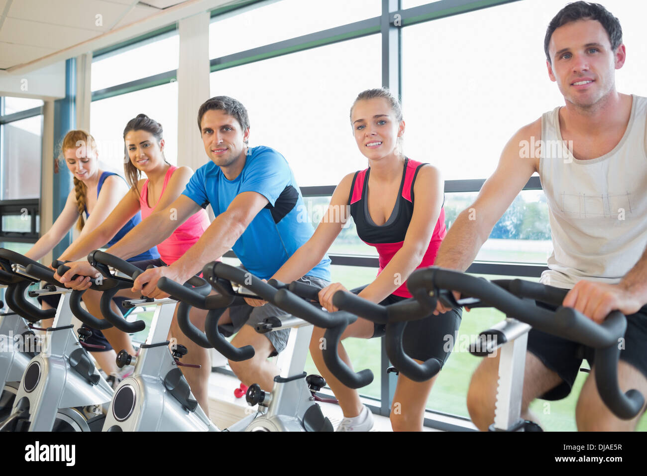 People working out at spinning class Stock Photo - Alamy