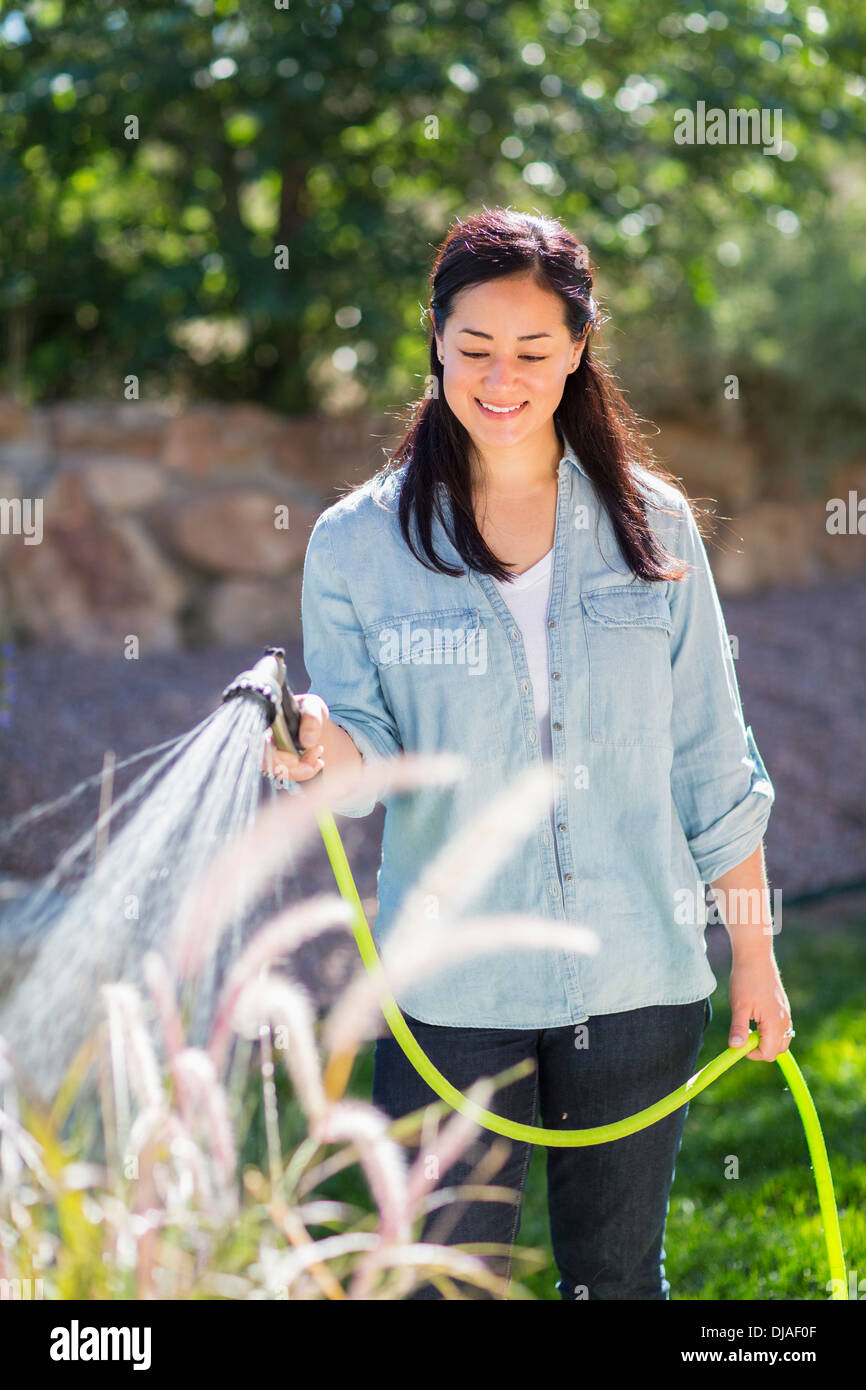 Person watering plants hi-res stock photography and images - Alamy