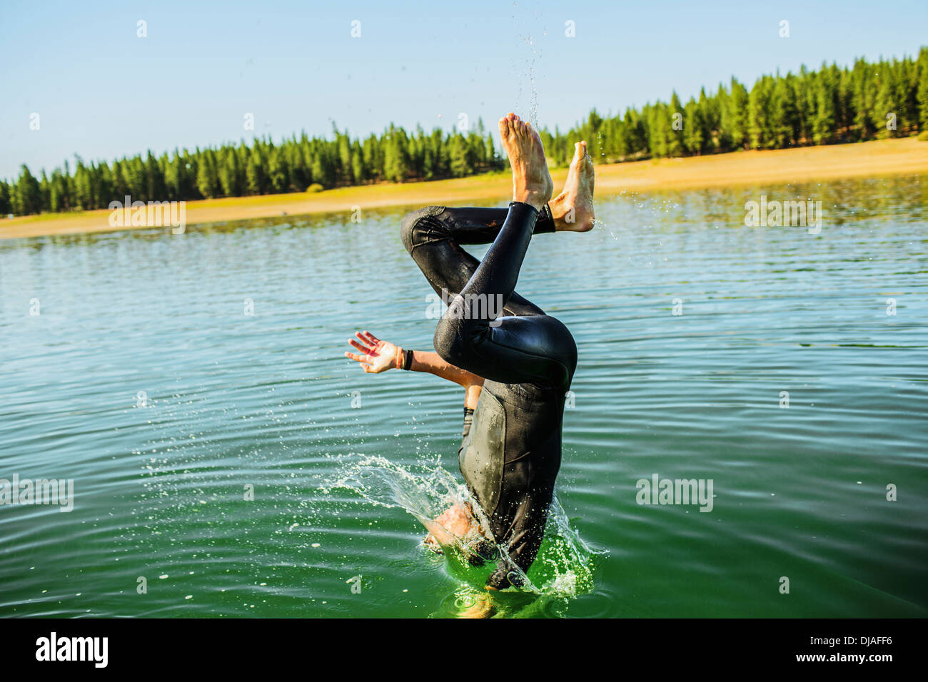 Man jumping into lake hi-res stock photography and images - Alamy