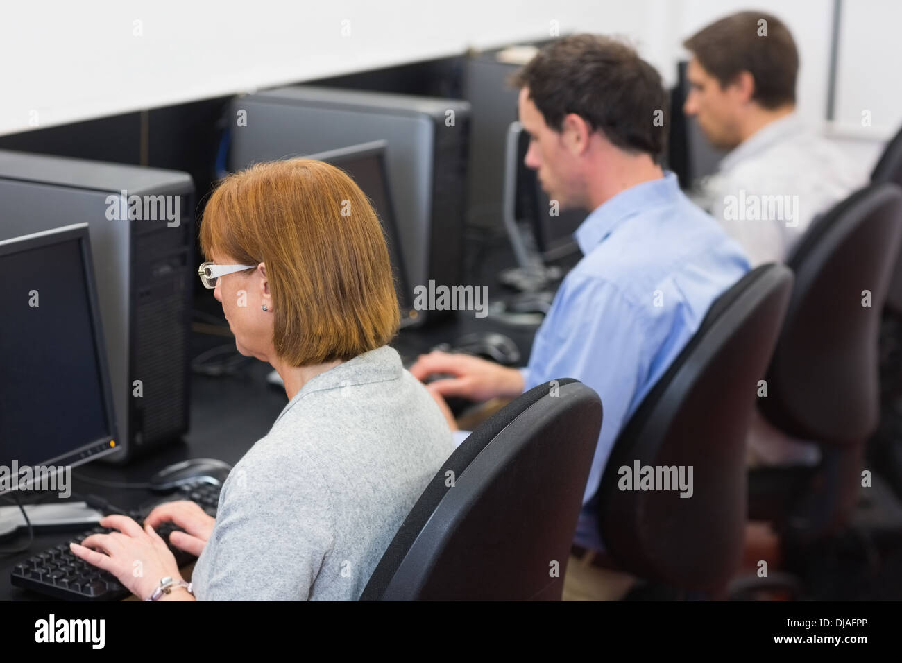 Mature students in the computer room Stock Photo - Alamy