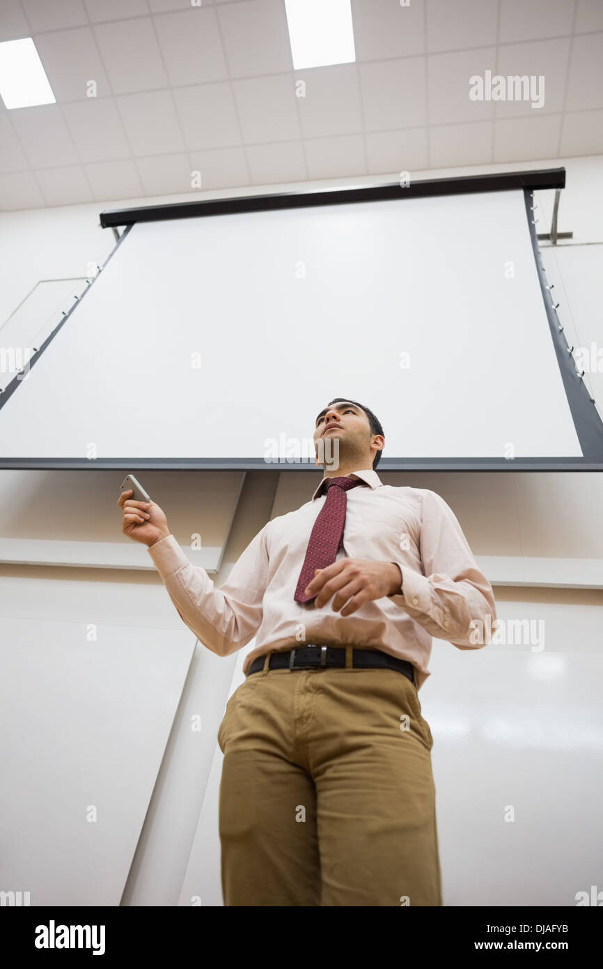 Male teacher with projection screen in the lecture hall Stock Photo - Alamy