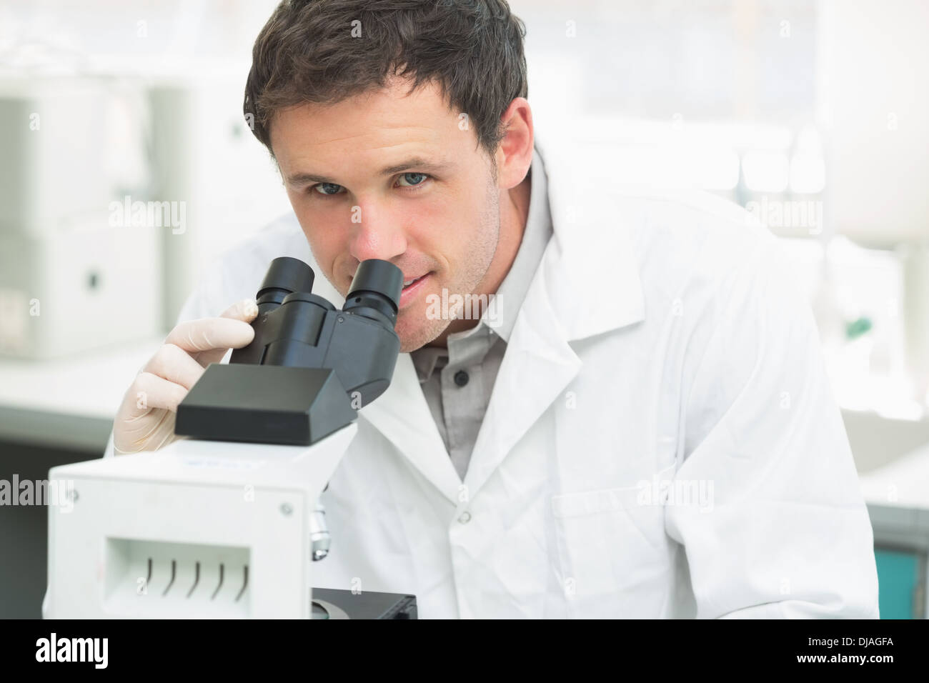 Scientific researcher using microscope in the laboratory Stock Photo ...
