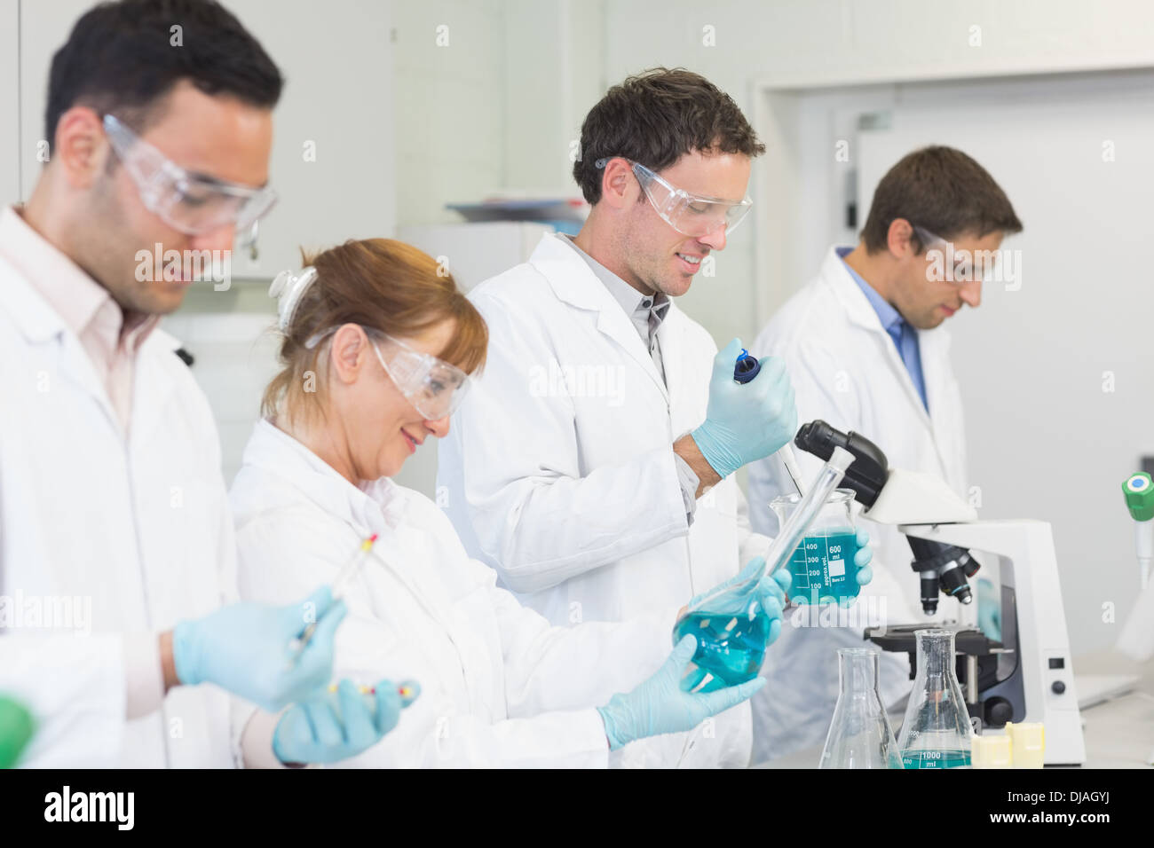Group laboratory scientists examining hi-res stock photography and ...