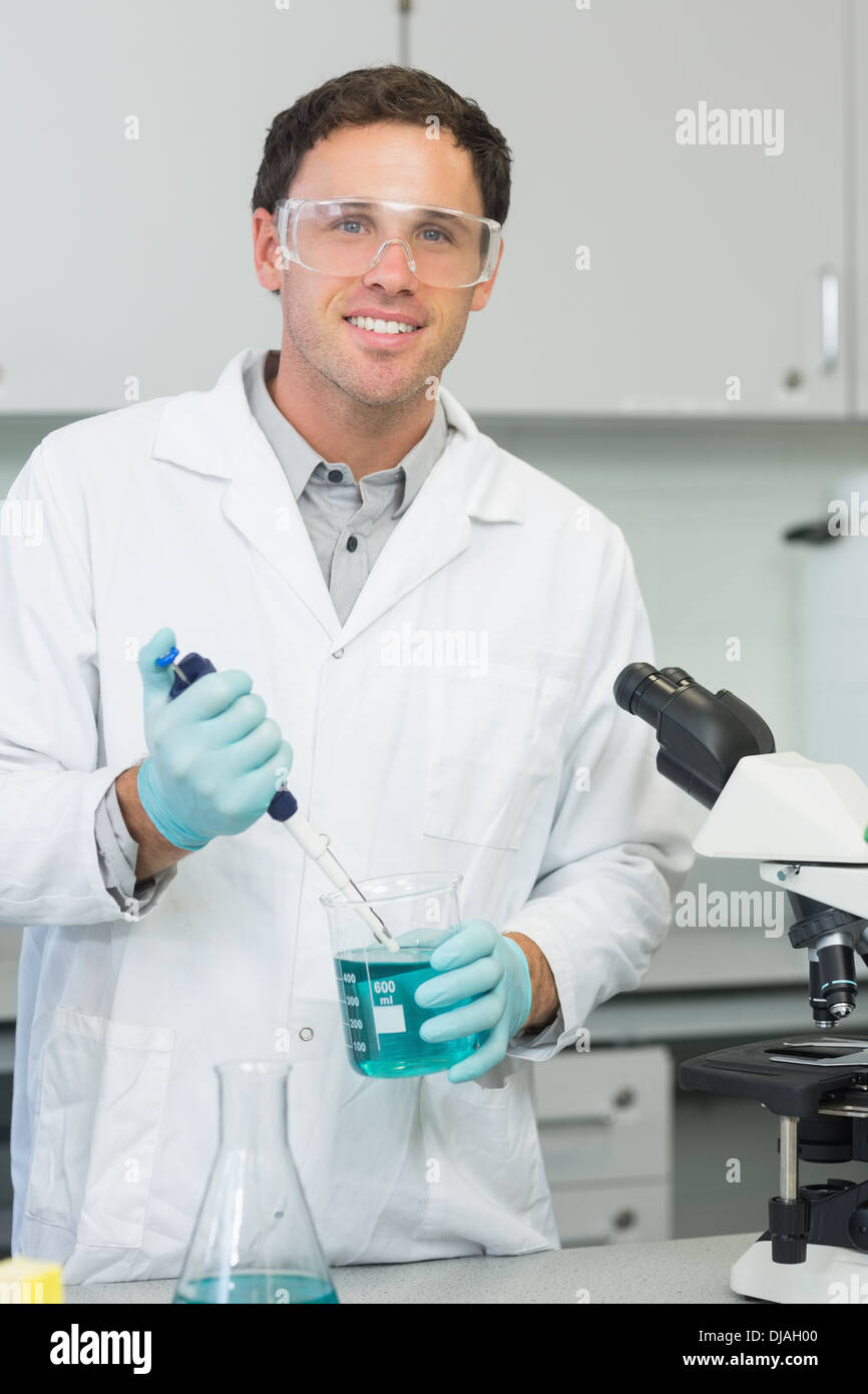 Male researcher carrying out experiments in the lab Stock Photo - Alamy